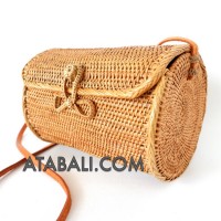 ata bucket bag with long leather strap and rattan cross clip