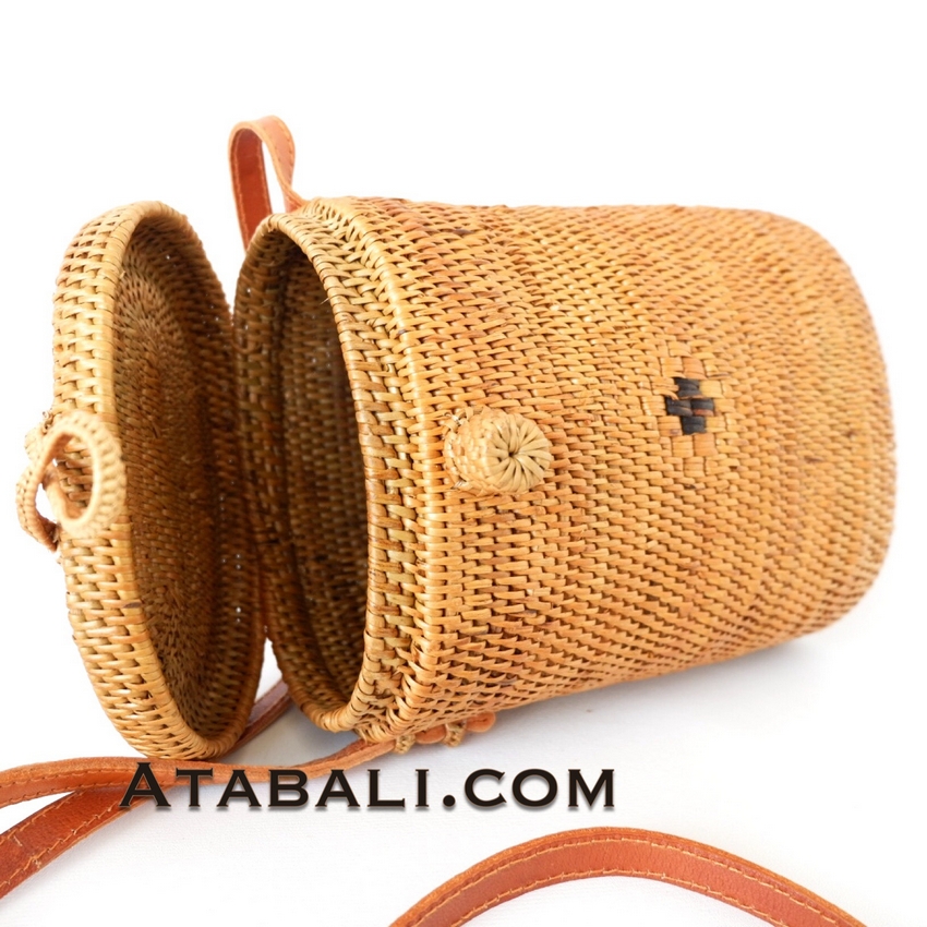 ata bucket bag with long leather strap and rattan cross clip