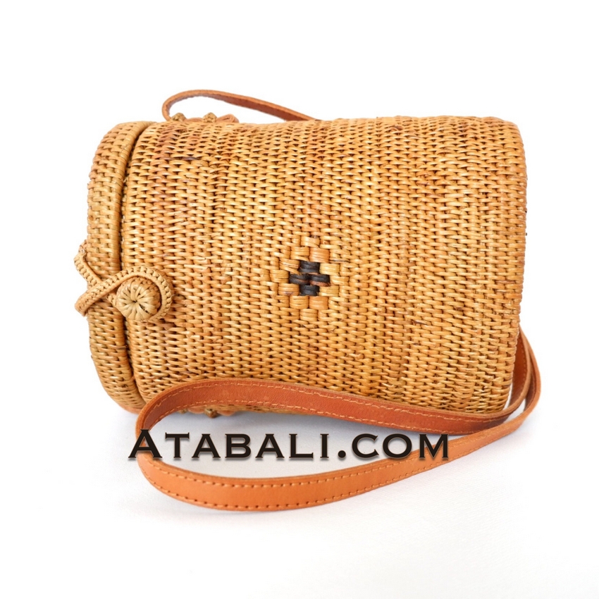 ata bucket bag with long leather strap and rattan cross clip