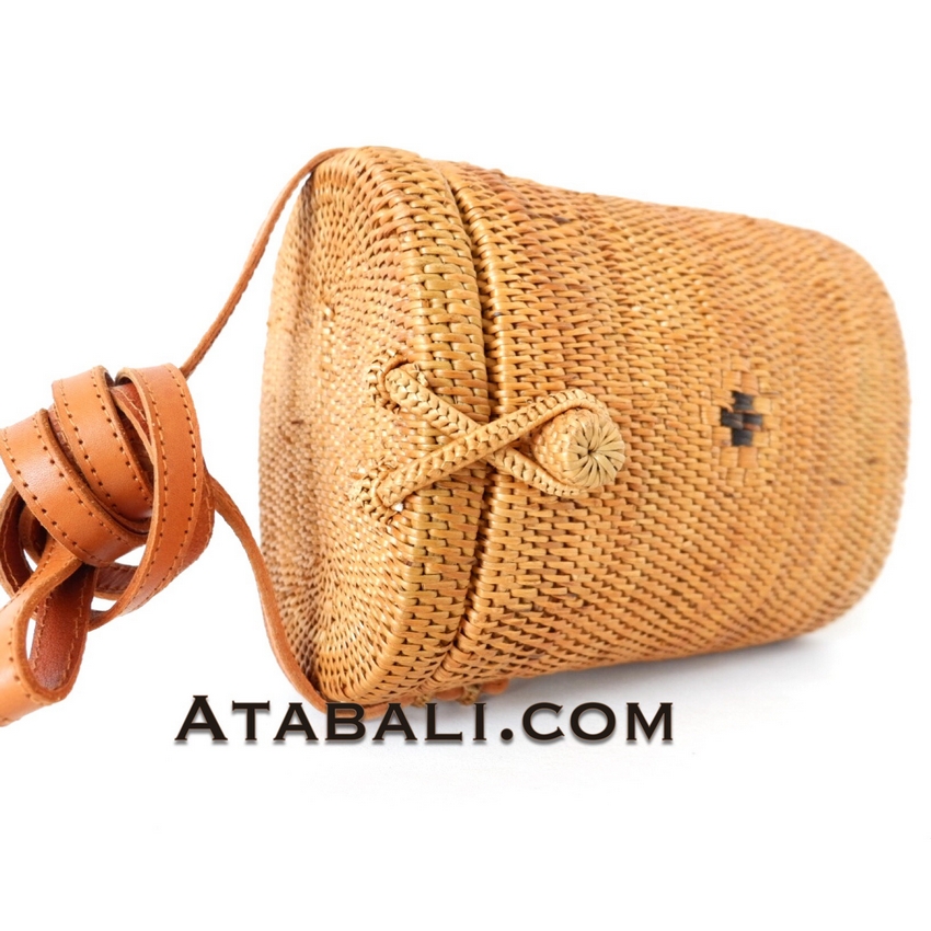ata bucket bag with long leather strap and rattan cross clip
