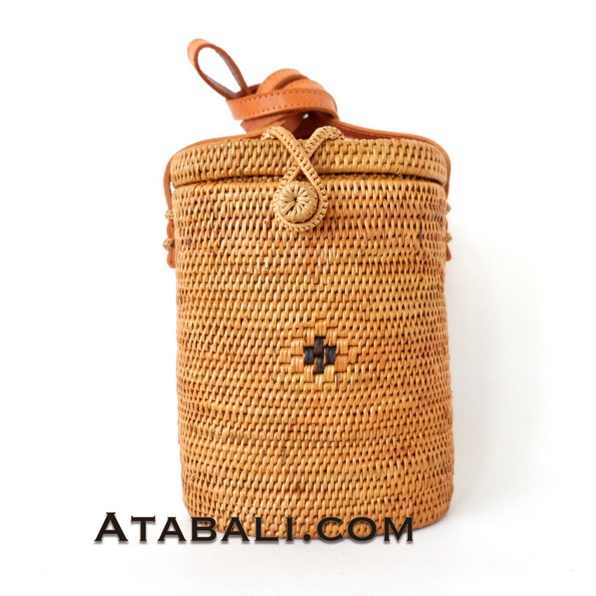 ata bucket bag with long leather strap and rattan cross clip