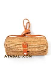 ata bucket bag with long leather strap and rattan cross clip