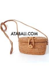ata bucket bag with long leather strap and rattan cross clip