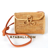 ata bucket bag with long leather strap and rattan cross clip